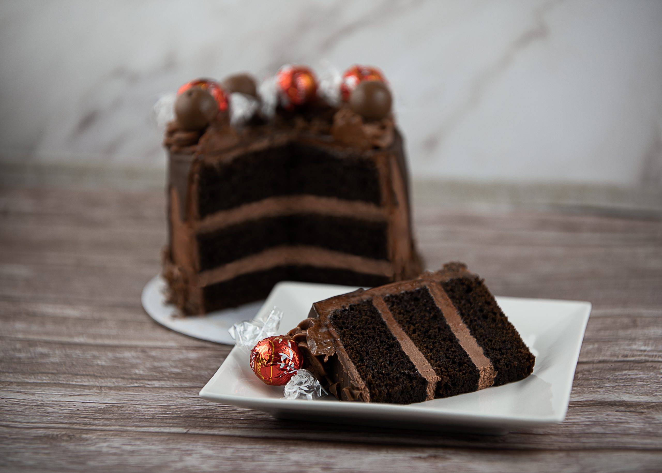 The Lindt Deluxe Chocolate Cake – Desserts Delivered Bakery